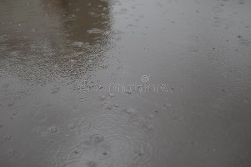 Rain Outside. Drops in Puddle Stock Image - Image of city, fashion ...