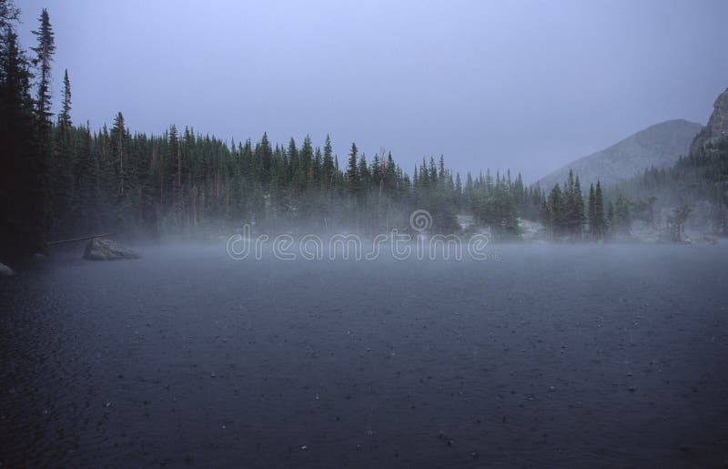 Rain Over Alpine Lake in Rocky Mountains Stock Photo - Image of ...