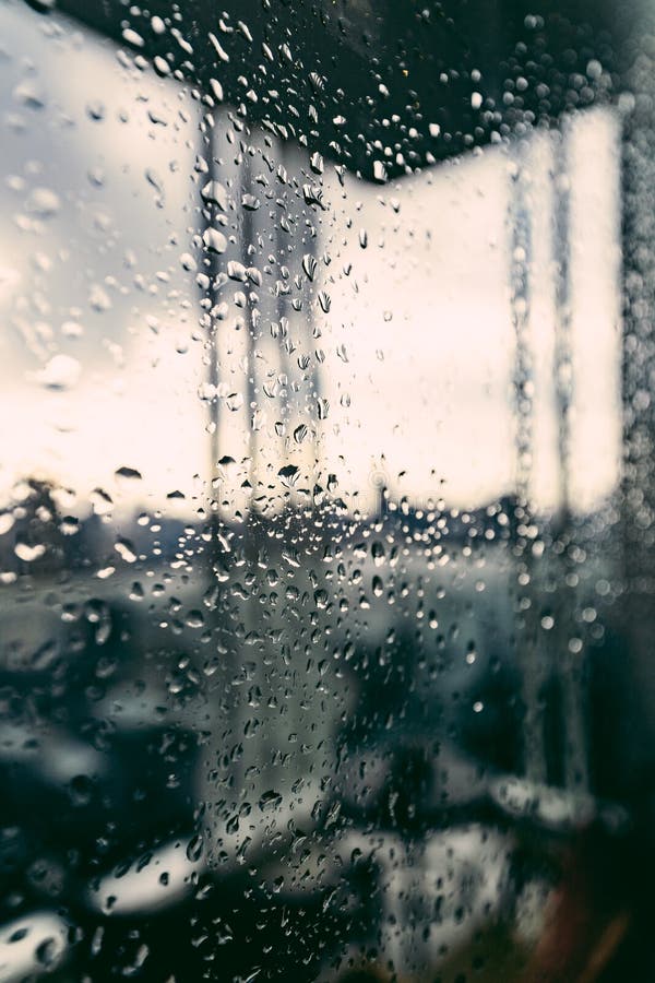 Rain Over Bangkok: Out of Focus Cityscape Behind the Window Glass with ...