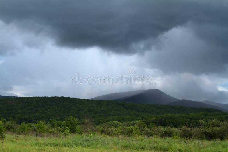 Rain over the mountains stock photo. Image of spring - 19896470