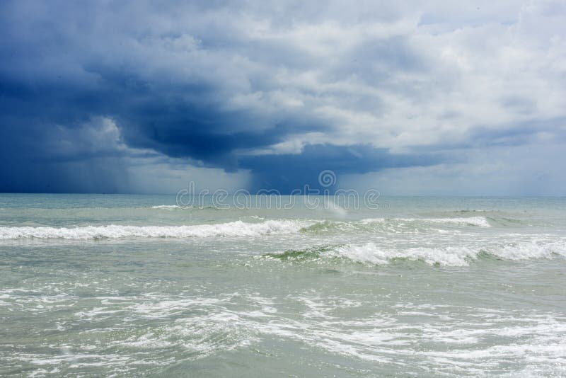 Rain over the sea clouds stock image. Image of deserted - 96507181