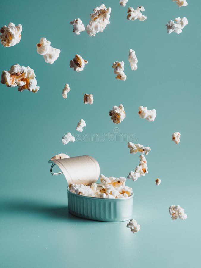 Rain of Popcorn Falling Inside a Can or Tin, Isolated on Light Green ...