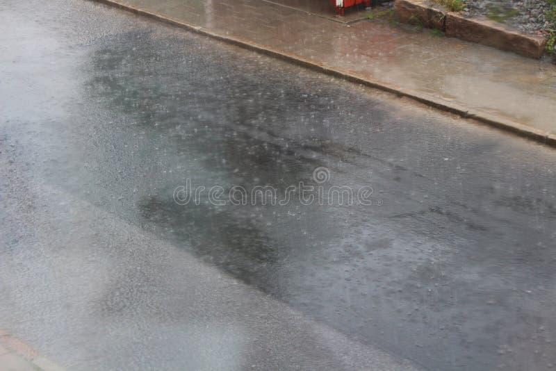 The Rain is Pouring Down the Street Stock Photo - Image of masses ...