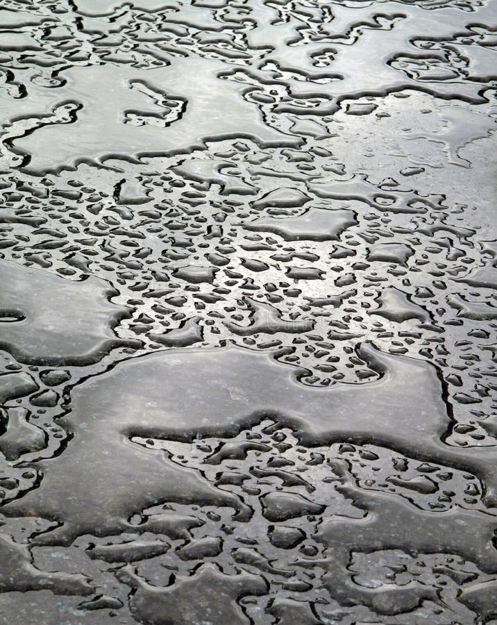 Rain Puddles on Black Marble Stock Image - Image of contours, event ...