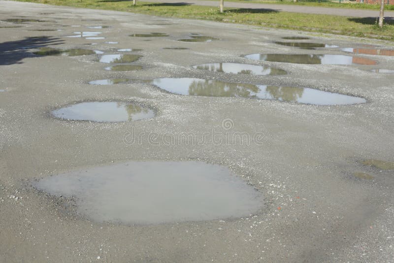 Rain puddles stock image. Image of puddle, pavement, footpath - 98378869