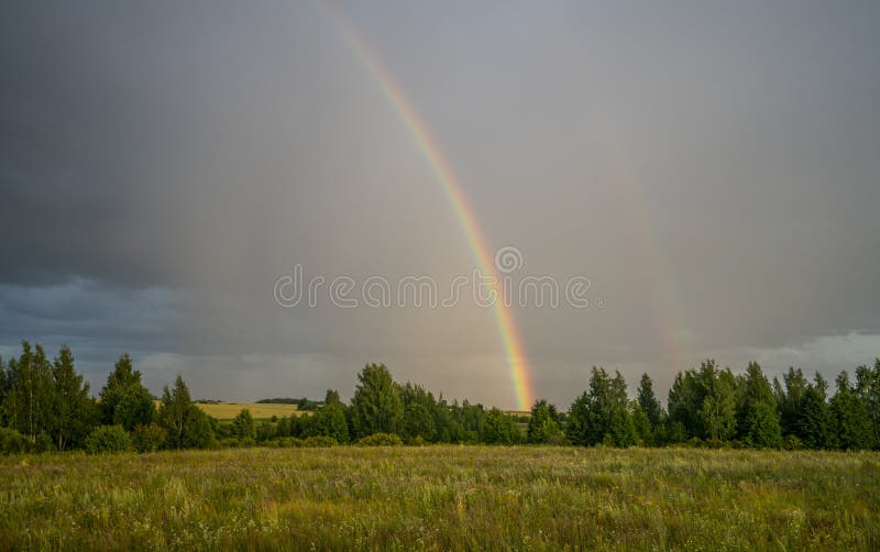 Rain and Rainbow Over Fields and Tree Planting Stock Photo - Image of ...
