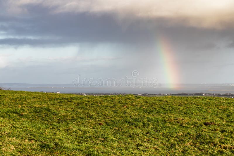 Rain and Rainbow Over Galway Bay Stock Photo - Image of rainbow, ocean ...