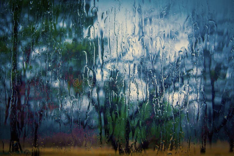 Rain Runs Down Window Pane with Trees Stock Image - Image of blurred ...