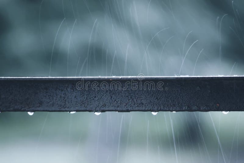 Rain Splashes on Railing Outdoors. Rainy Day. Water Drops. Stock Image ...