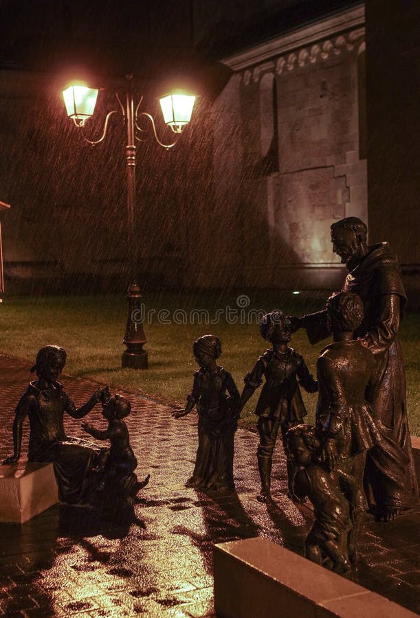 Rain stock image. Image of statue, spotlight, rain, children - 91722947