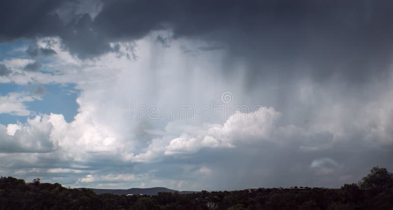 Rain Storm on the Horizon Over Dark Forested Landscape - Dramatic with ...
