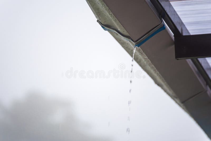 Rain Storm with Metal Sheet Roof,rainwater Flows Down the Roof Stock ...