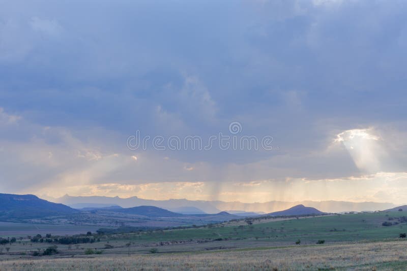 Rain and sun rays stock image. Image of valley, rain - 64979239