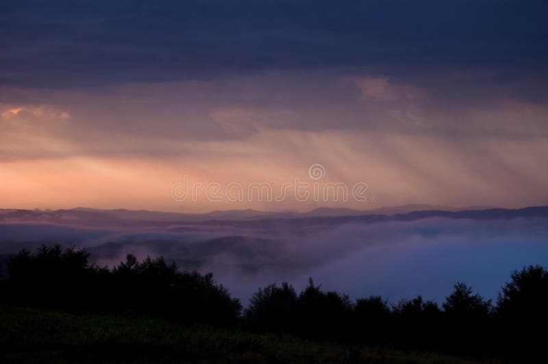 Rain at sunset stock photo. Image of landscape, cloud - 65764360