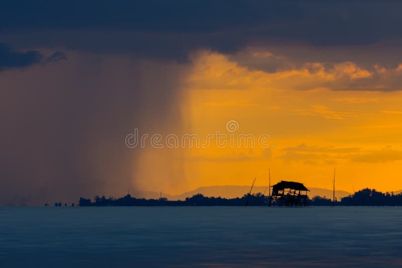 Rain and Sunshine at the Lake Stock Photo - Image of aura, dramatic ...