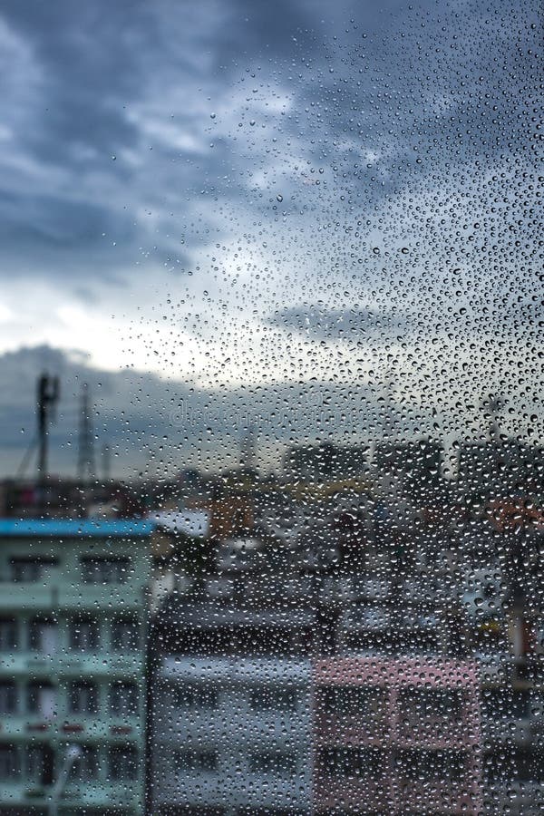 Rain / Water Drop of Rain on Glass with Building in City Background ...