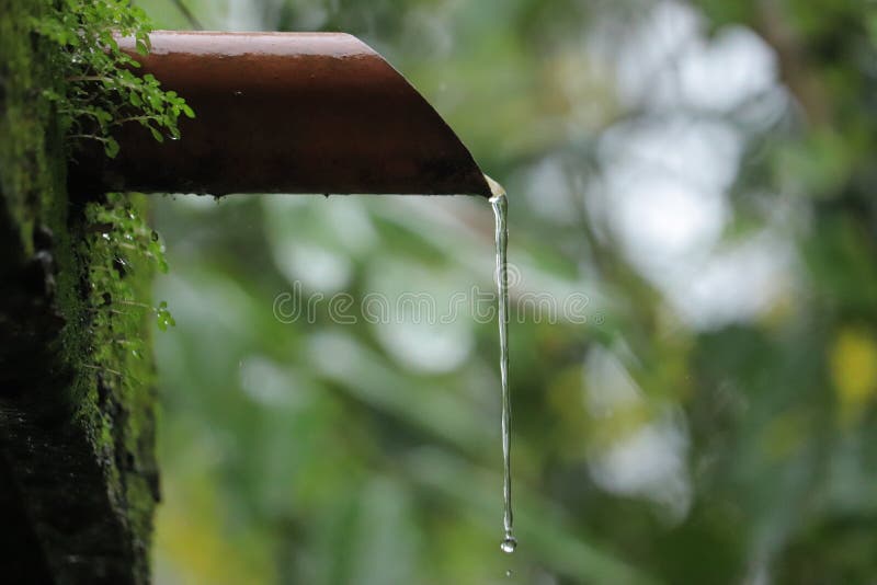 Water Dropping from Orange Pipe Stock Photo - Image of losing, deluge ...
