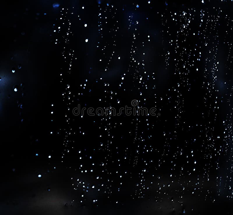 4k Heavy Angled Rain Falling in Front of the Camera Against Black ...