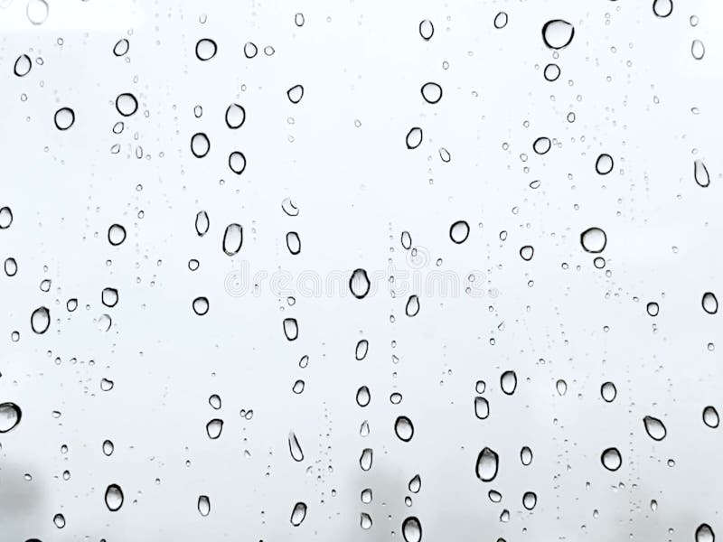 Rain Water Drops Falling Down on the Window Glass .white Water Drops on ...