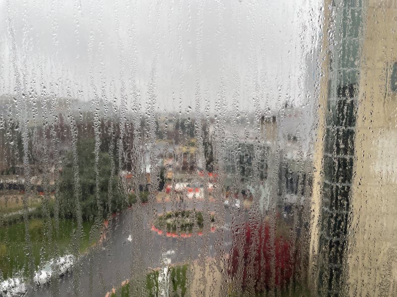 Rain Water on a Window Looking Down on Buildings Stock Image - Image of ...