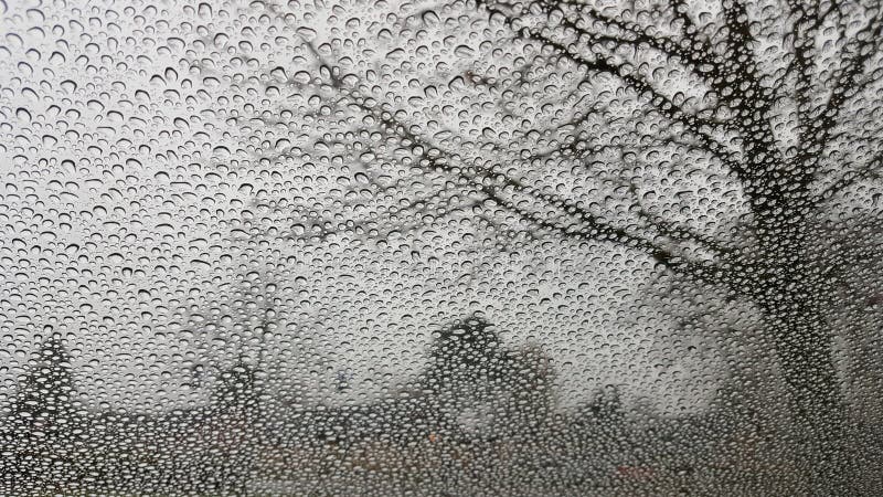 Rain on Window Glass with Tree and Buildings Stock Photo - Image of ...