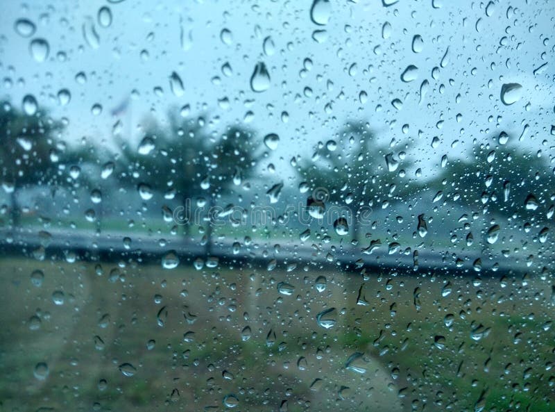 Rain on Window with Tree Background. Photo. Stock Photo - Image of ...