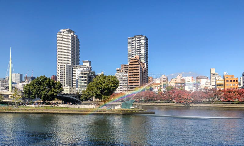 Rainbow above the river editorial photo. Image of tower - 201958161