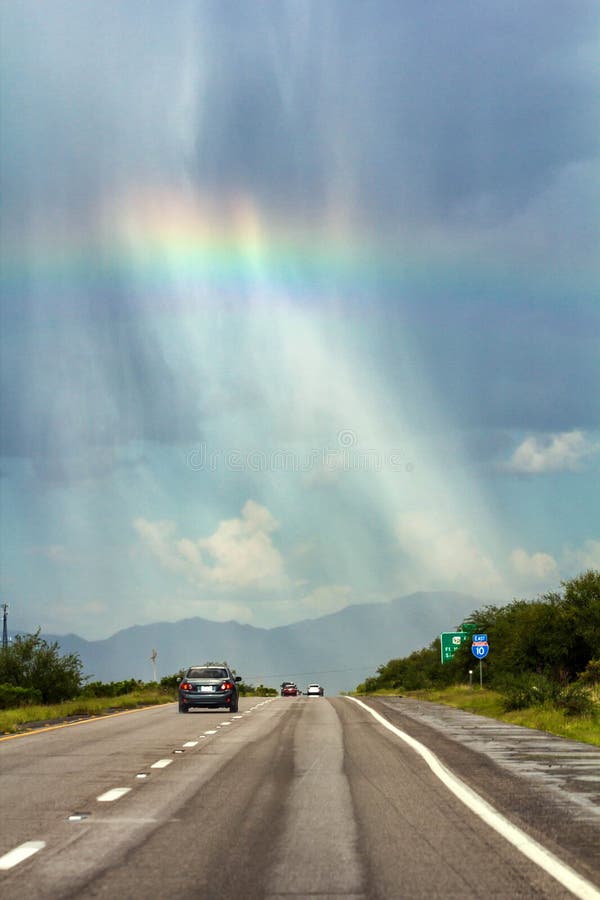 Rainbow above long road editorial image. Image of distant - 176465375