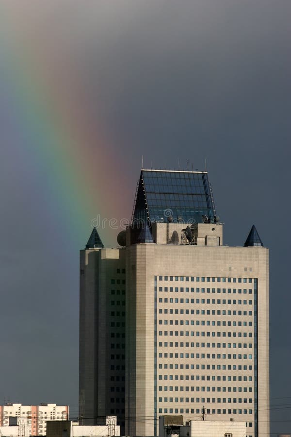 Rainbow above a skyscraper stock photo. Image of green - 826522