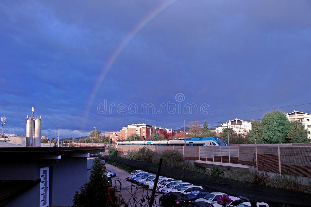 Rainbow above the train editorial stock image. Image of reflection ...