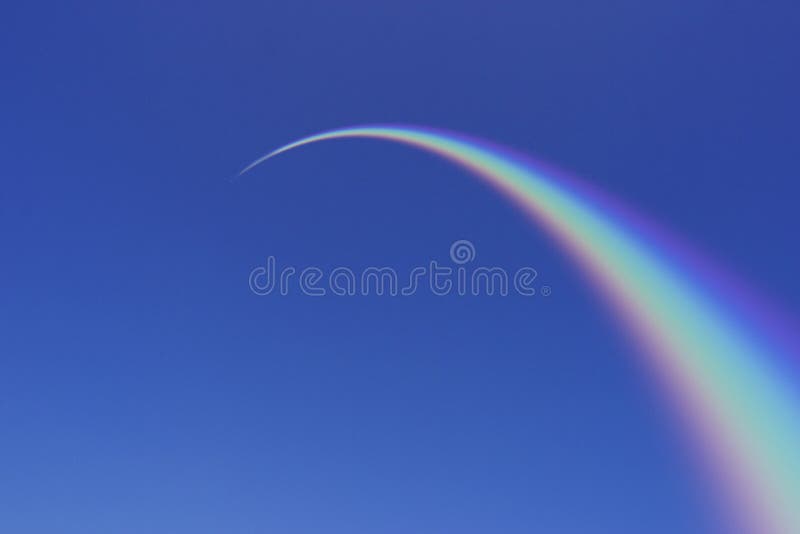 Rainbow Arcing through Blue Sky Stock Image - Image of shape, moisture ...