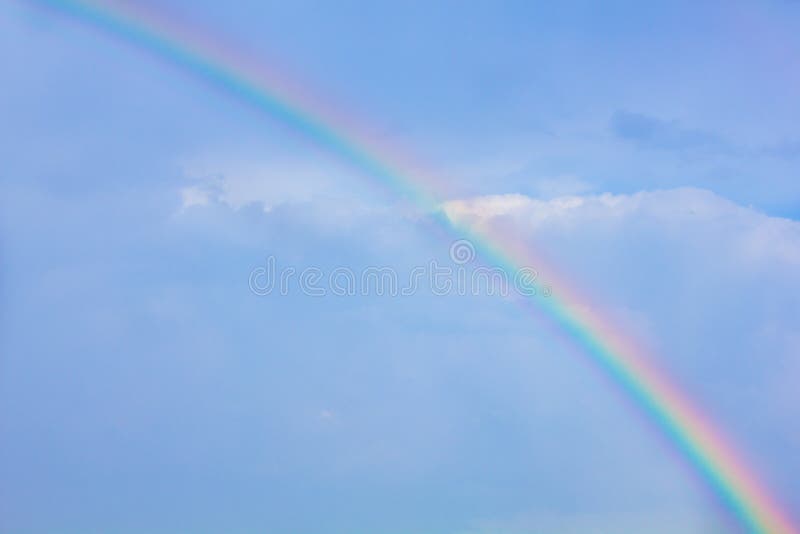 Rainbow in the Blue Sky As Background Stock Image - Image of light ...