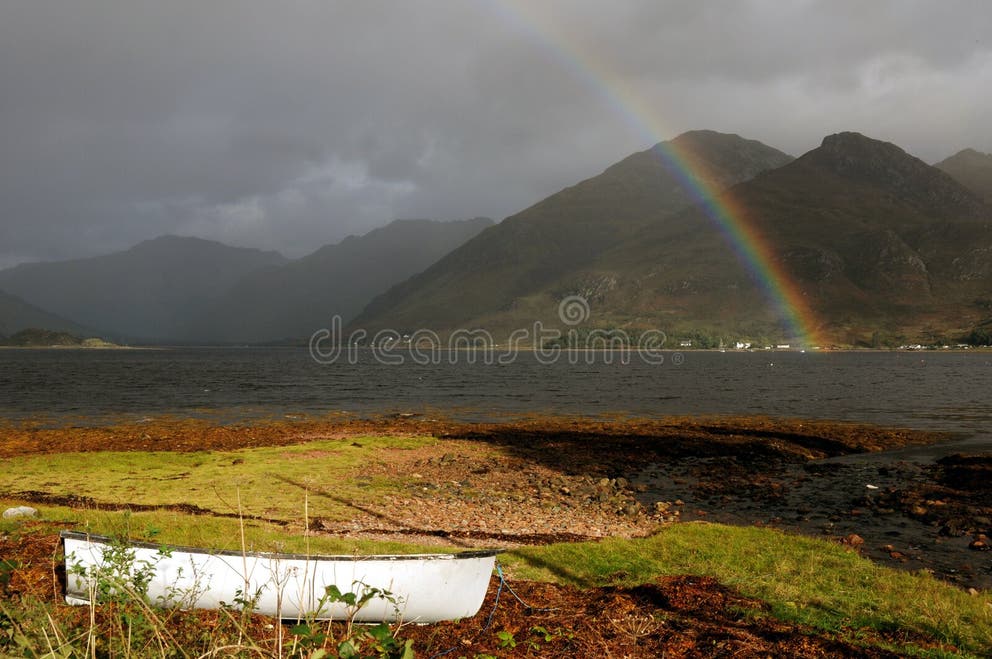 Rainbow and boat stock photo. Image of tide, scotland - 18187714