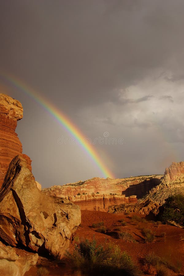 Rainbow and Brief Dramatic Sunshine Stock Image - Image of arch, clouds ...