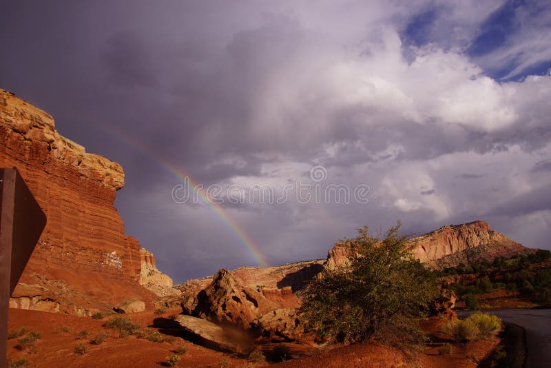 Rainbow and Brief Dramatic Sunshine Stock Photo - Image of sunshine ...