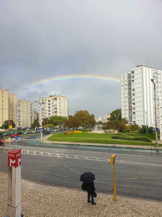 Rainbow between Buildings in the Urbanized Area in Olivais Lisbon ...