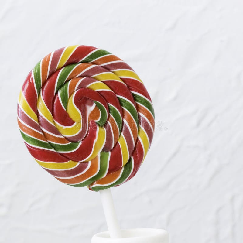 Rainbow candy on a stick stock photo. Image of confection - 164351924