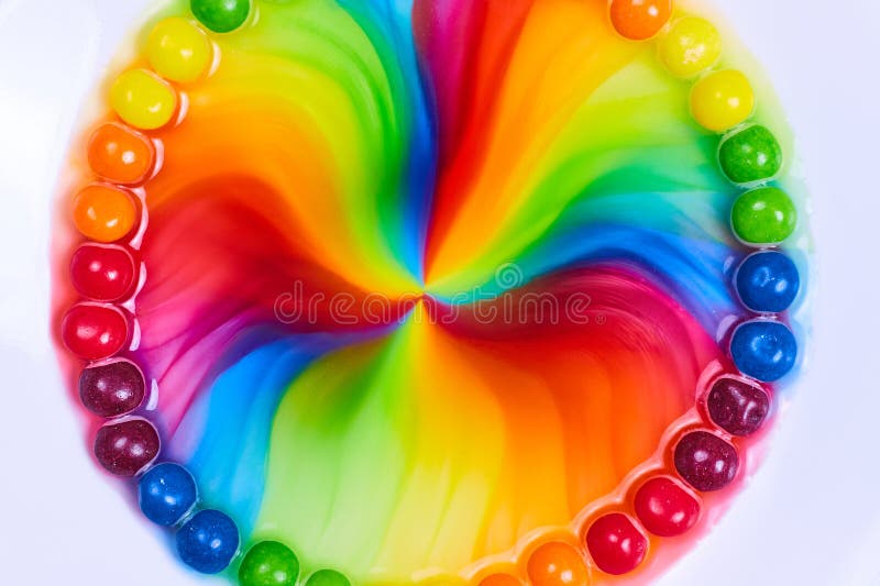Rainbow Circle in Water Inside Ring of Skittles Candy Stock Photo ...