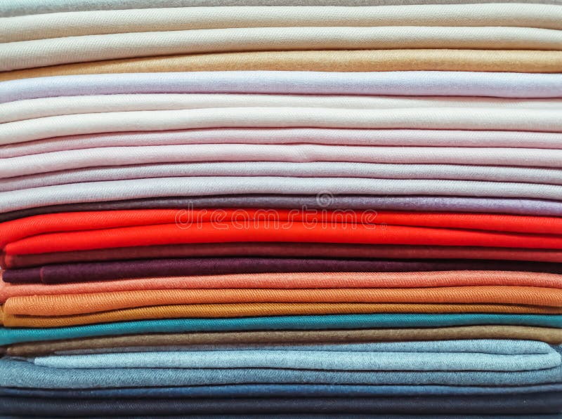 Rainbow Clothes Background. Pile of Bright Folded Clothes Stock Image ...