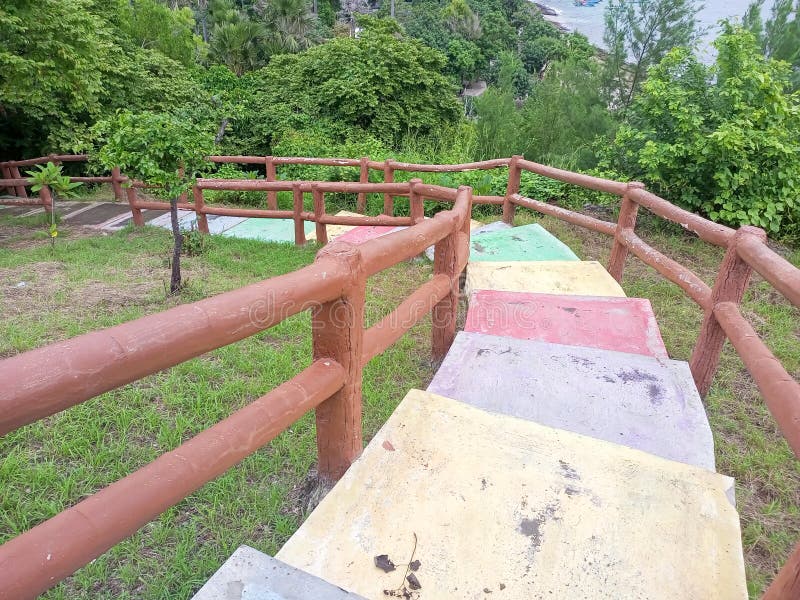 A Rainbow-colored Climbing Ladder in a Theme Park Stock Photo - Image ...