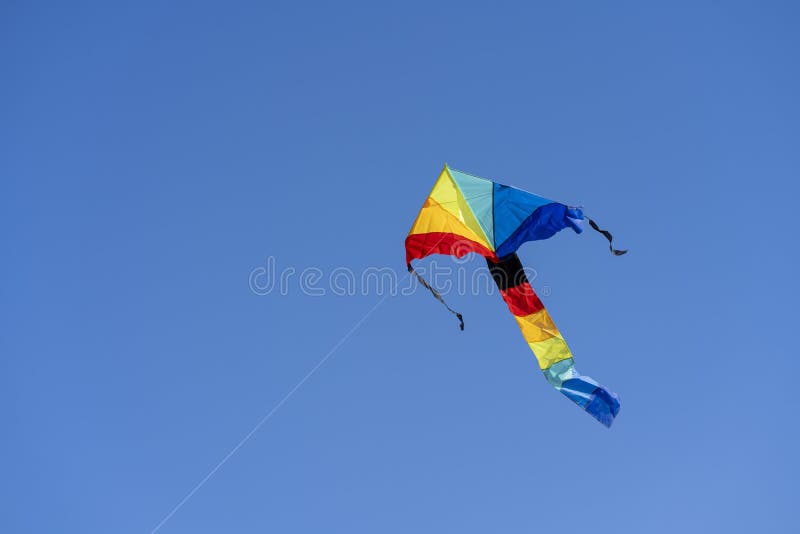 Rainbow colored kite stock image. Image of flight, happy - 250742201