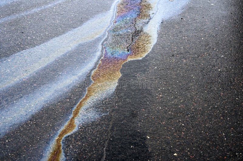A Rainbow Colored Oil Spill Creates a Striking Rainbow Effect on a ...