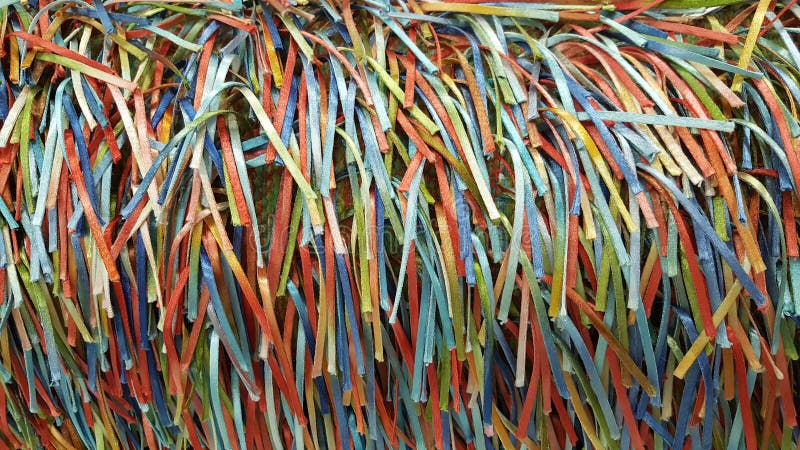 A Rainbow of Colorful Strands of Ribbons and Threads Stock Photo ...