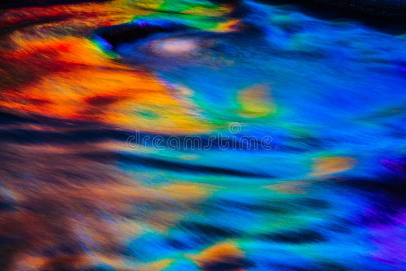 A Rainbow of Colors Being Reflecting in Water Stock Image - Image of ...
