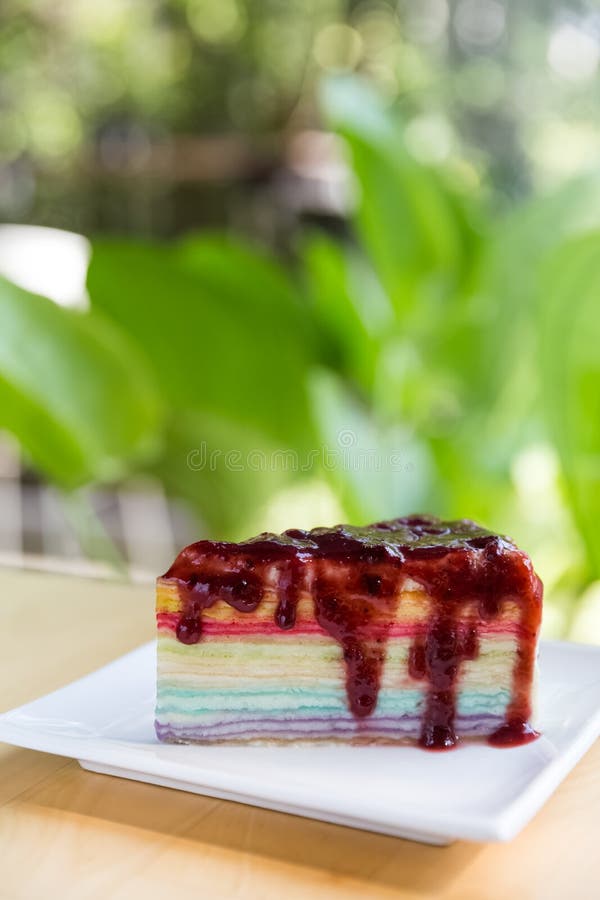 Rainbow Crepe Cake with Blueberry Syrup Stock Photo - Image of sugar ...