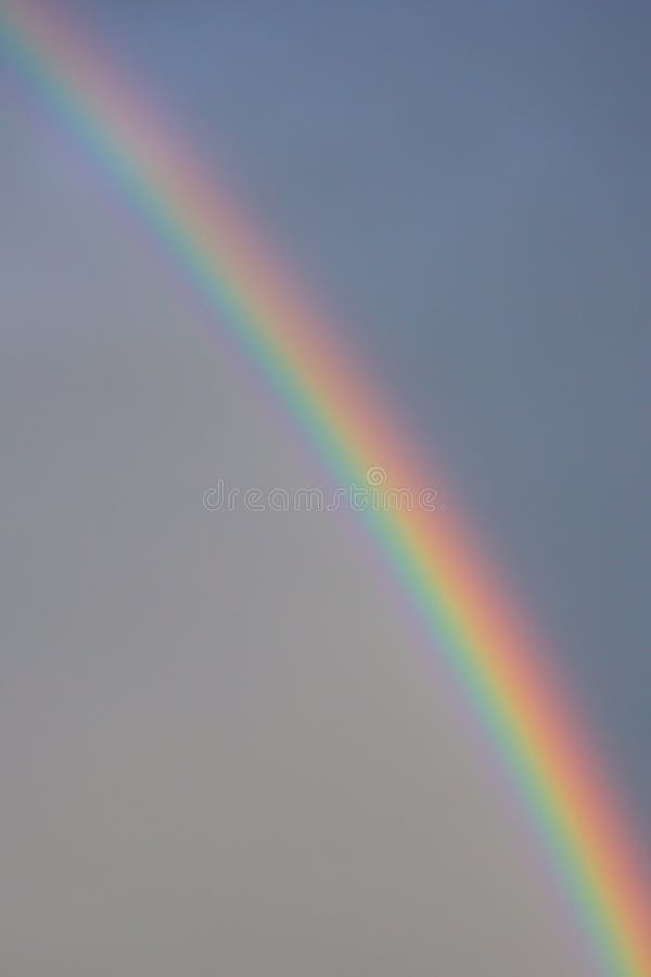 Rainbow on Cloudy Grey and Blue Sky Background Stock Image - Image of ...
