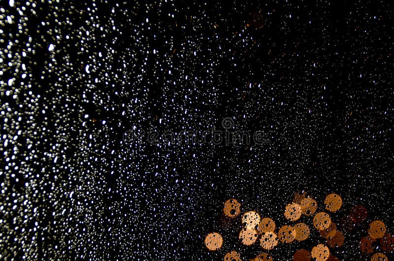 Rainbow Drops on Night Window with Blurry Lights, Black Background ...
