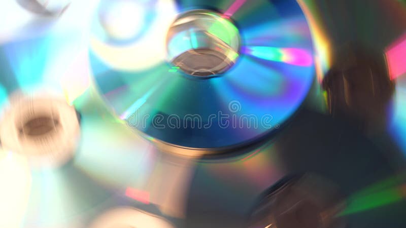 Rainbow Effect from Pile of CDs Disc Rotating on Black Background Stock ...