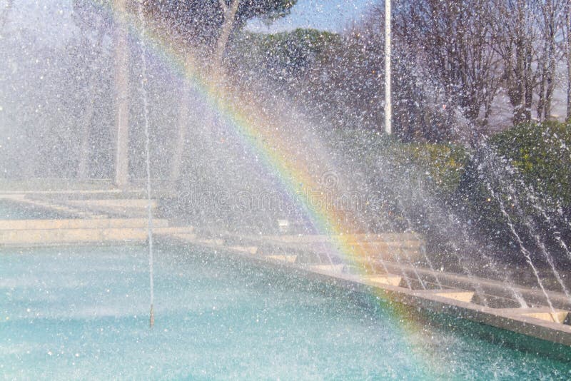 Rainbow Effect on Waterdrops Fountain Stock Photo - Image of park, blue ...