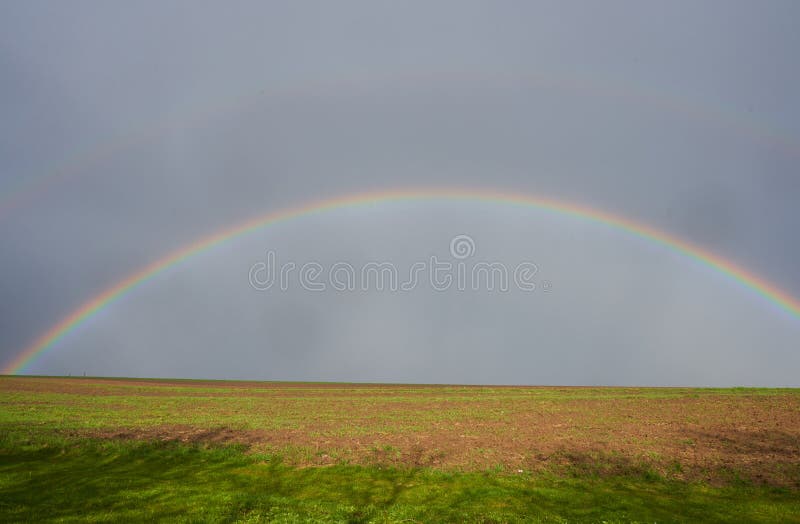 Rainbow in the Field,a Rainbow Appeared in the Sky in the Field in ...